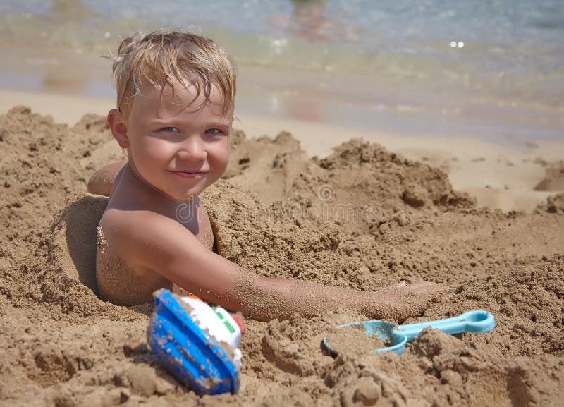 Boy play on th beach stock photo. Image of caucasian - 54834712