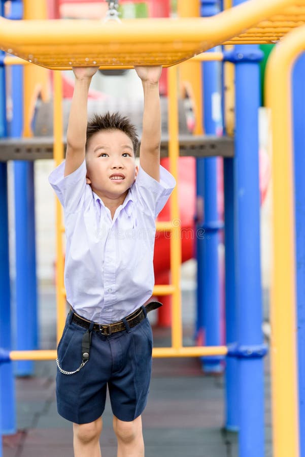 Boy play with yellow bar stock image. Image of activity - 77419755