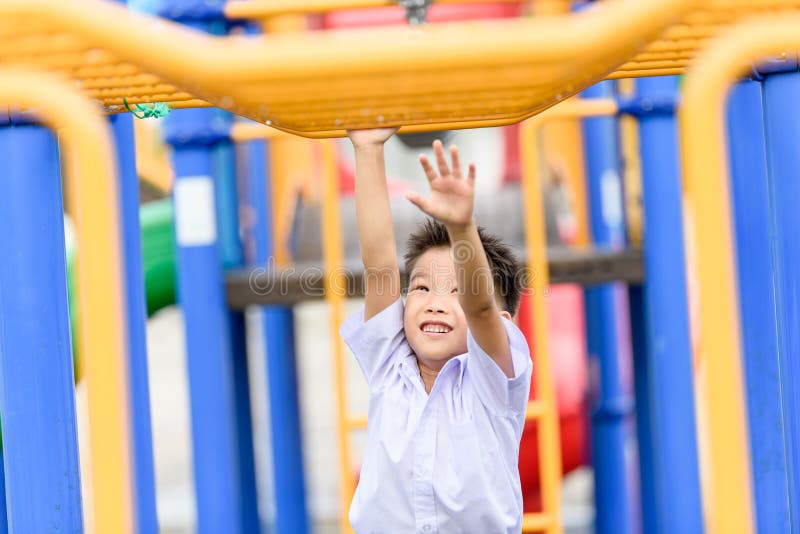 Boy play with yellow bar stock image. Image of activity - 77419755