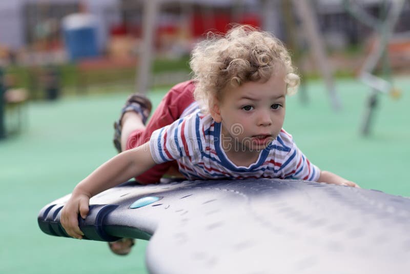 Boy at playground stock photo. Image of outdoor, curly - 33193558