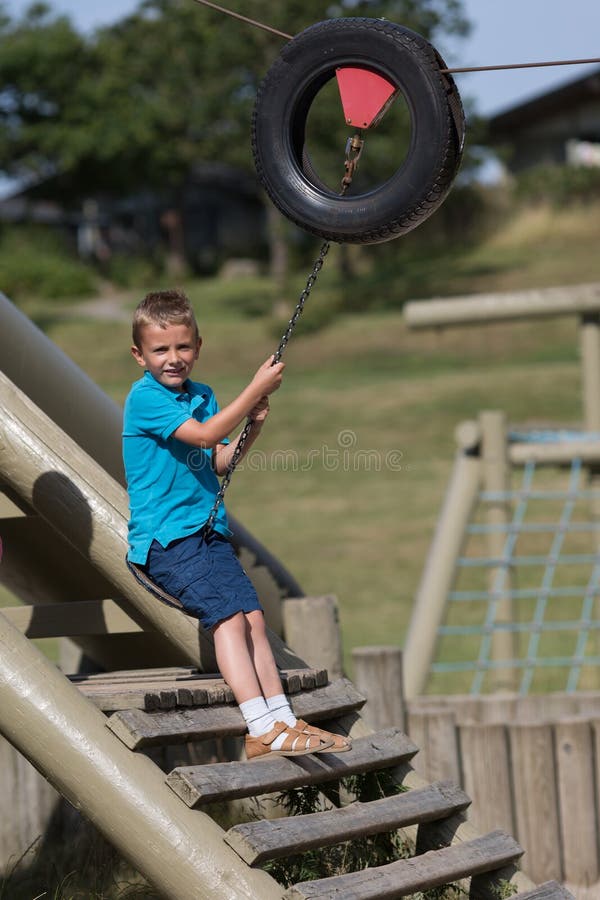 Boy at playground stock image. Image of kids, spring - 53496371