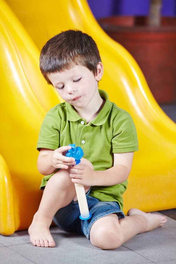 Boy Playing Alone in Kindergarten Stock Photo - Image of preschooler ...