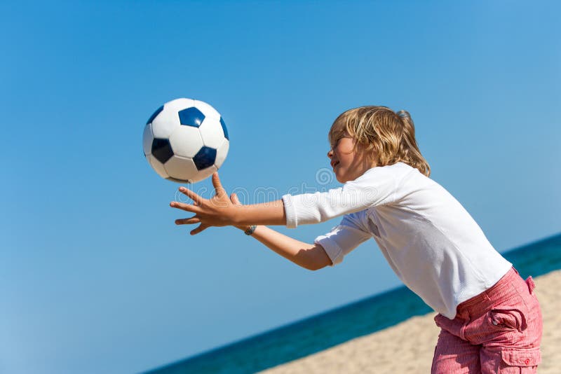Boy Playing with Ball on Beach. Stock Photo - Image of outdoor, leisure ...