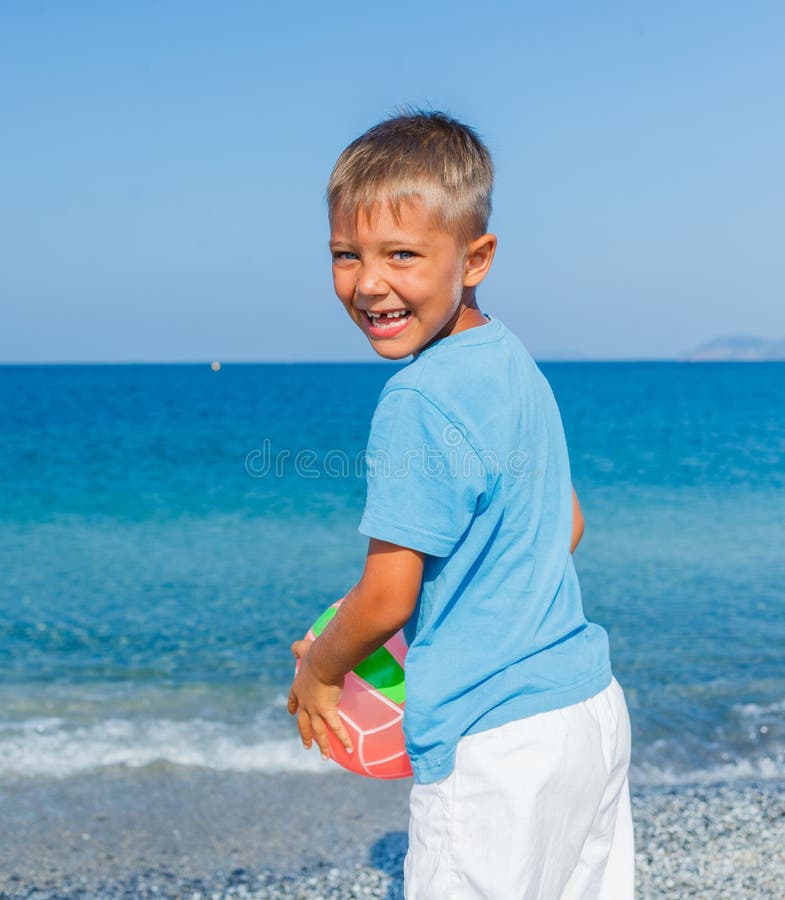 Boy Playing Ball at the Beach Stock Image - Image of blond, recreation ...