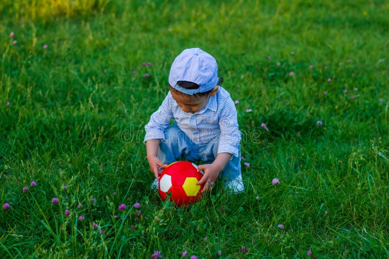 Boy Playing with Ball, Little Boy Playing with Ball in Park Stock Image ...