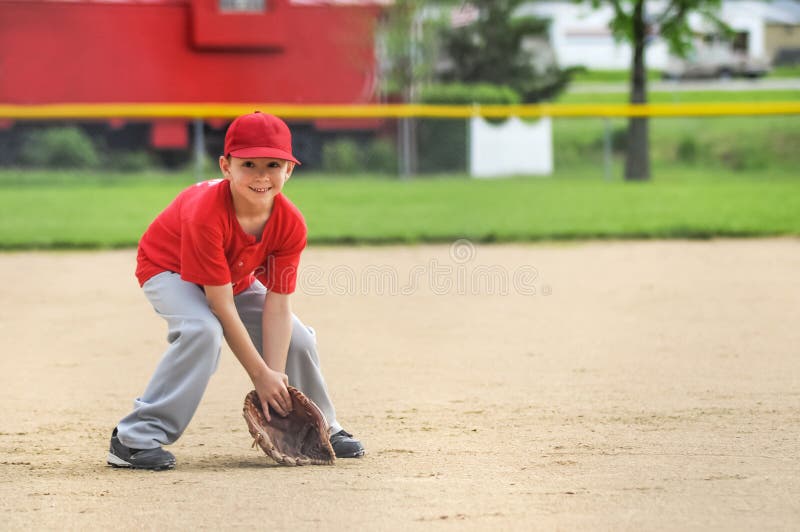 Boy playing baseball stock image. Image of field, uniform - 39757599