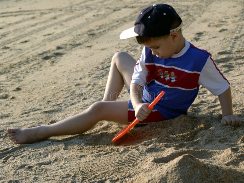 Boy playing on the beach stock photo. Image of face, longshore - 5753020