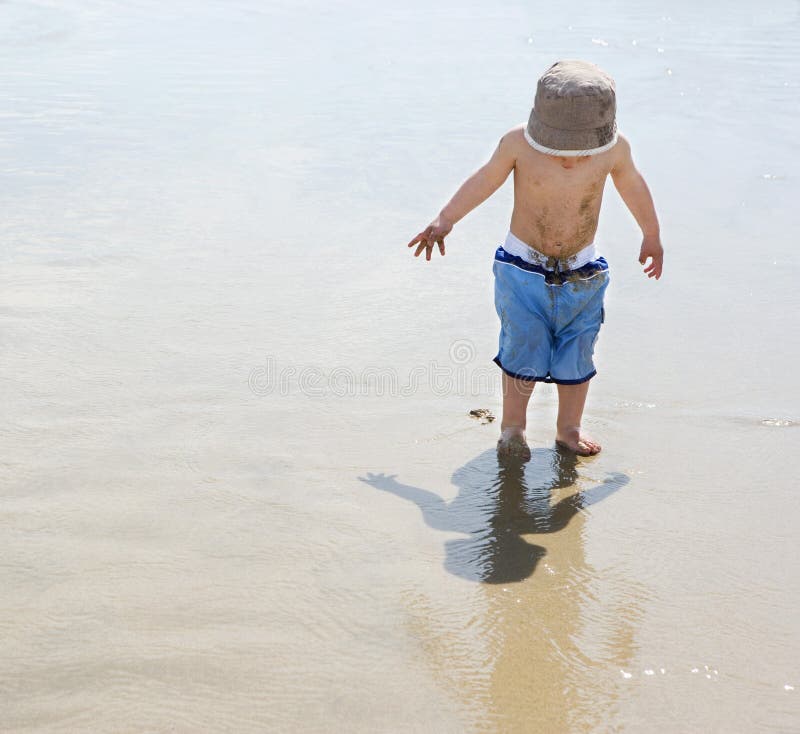 Boy (3-4) Playing on Beach Back View Stock Image - Image of face ...