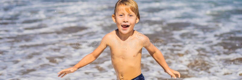 Boy Playing on the Beach in the Water BANNER, LONG FORMAT Stock Photo ...