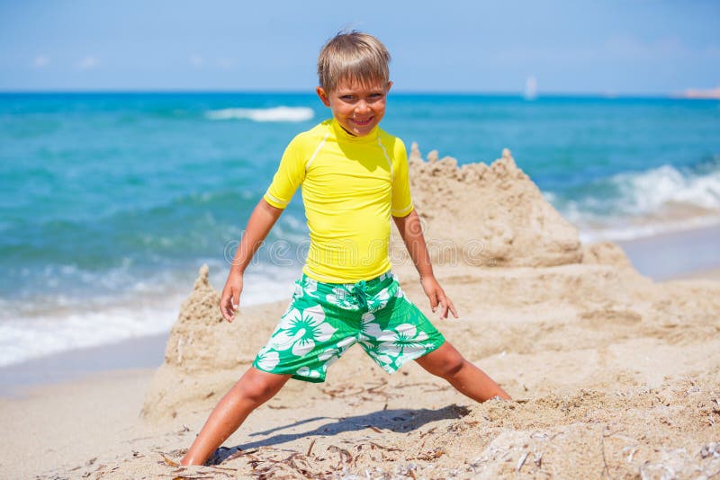 Boy playing on the beach stock photo. Image of happiness - 51373624