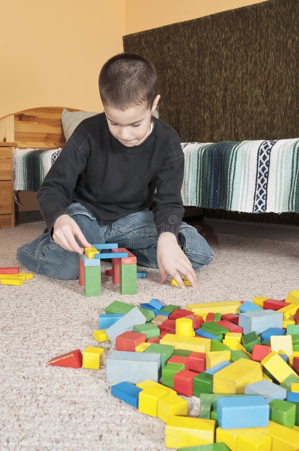 Boy playing with blocks stock image. Image of lots, creativity - 37686311