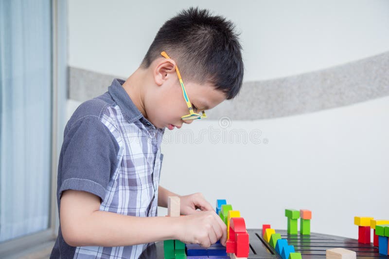 Boy Playing Blocks on Table Stock Photo - Image of childhood, game ...