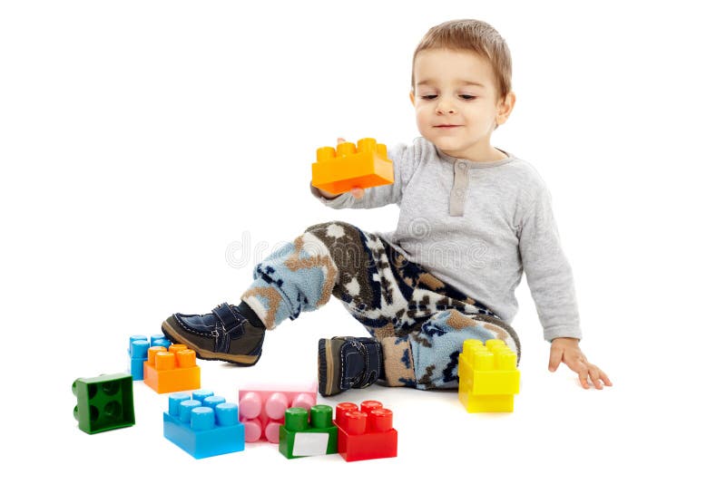 Boy playing with blocks stock image. Image of education - 36936975