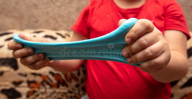 The Boy is Playing with a Blue Slime Stock Image - Image of family ...