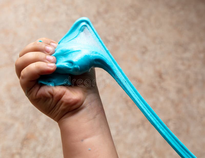 The Boy is Playing with a Blue Slime Stock Image - Image of mother ...