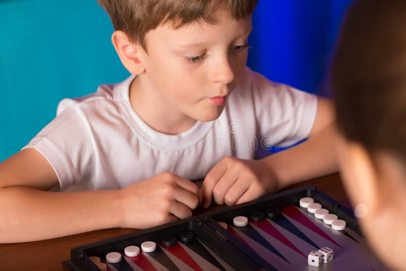 Boy Playing a Board Game Called Backgammon Stock Photo - Image of ...
