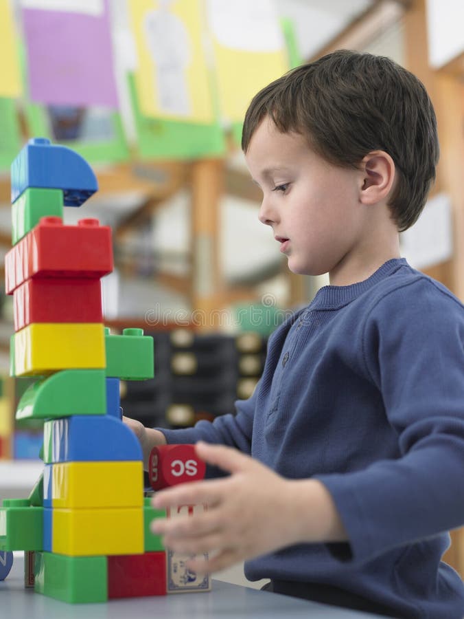 Young Preschool Children Playing Building Blocks in School Class Stock ...