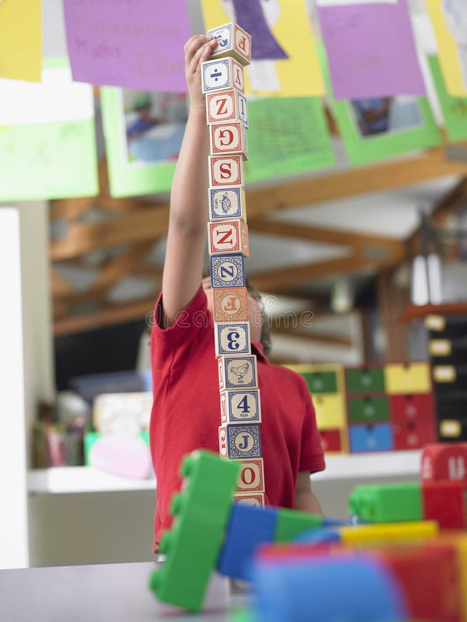 Boy Playing with Building Blocks in Class Stock Image - Image of mixed ...