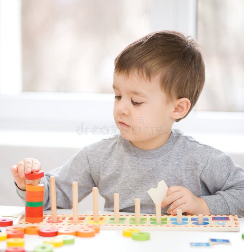 Boy is Playing with Building Blocks Stock Photo - Image of preschool ...