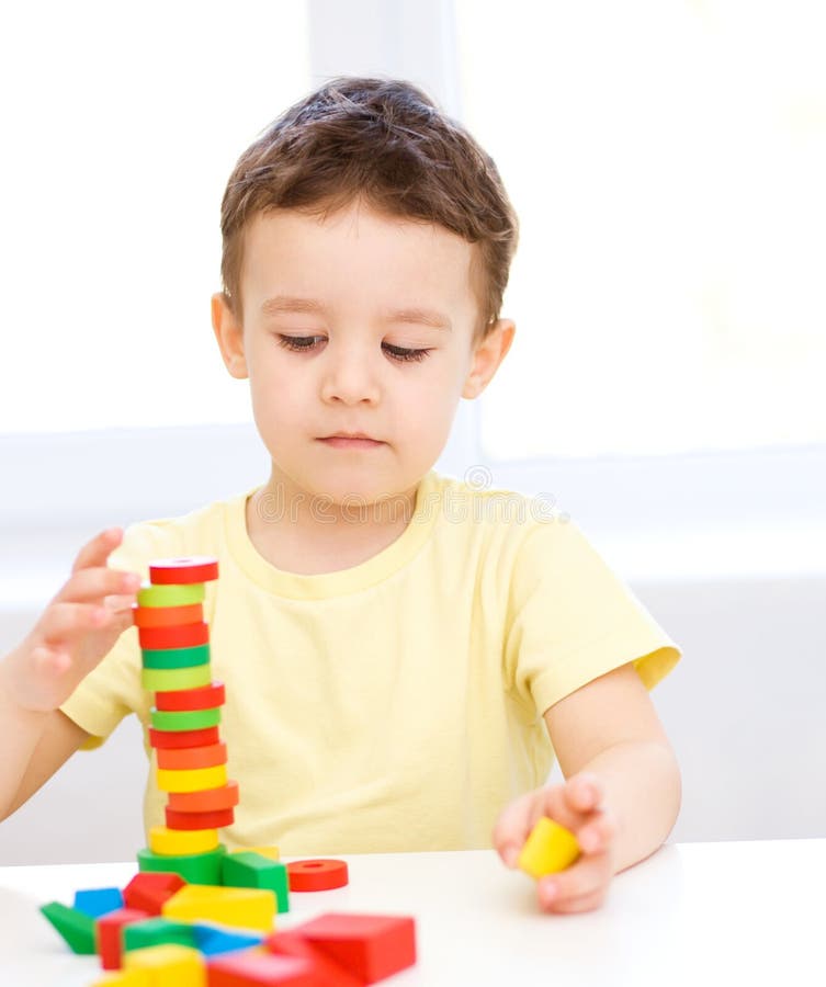 Boy is Playing with Building Blocks Stock Image - Image of childhood ...