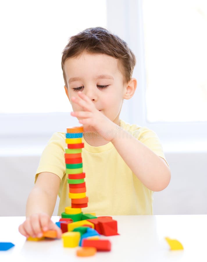 Boy is Playing with Building Blocks Stock Photo - Image of cute, person ...