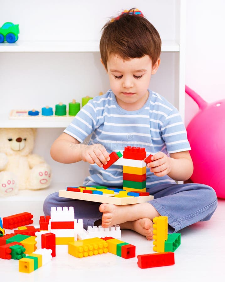 Boy is Playing with Building Blocks Stock Photo - Image of male ...