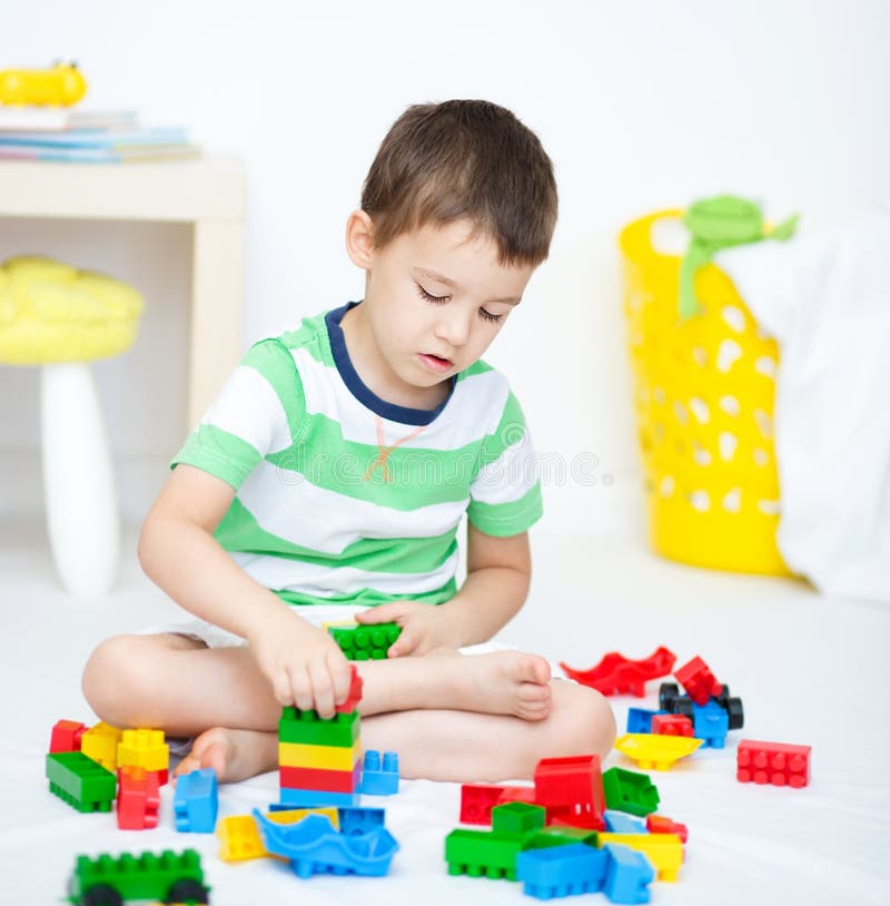 Boy is Playing with Building Blocks Stock Photo - Image of close ...
