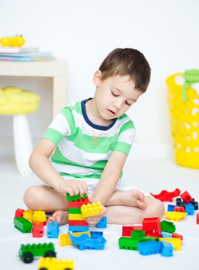 Boy is Playing with Building Blocks Stock Photo - Image of childhood ...