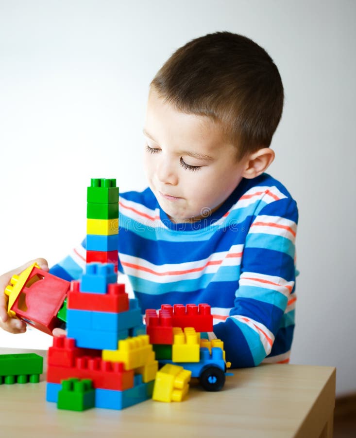 Boy is Playing with Building Blocks Stock Photo - Image of closeup ...