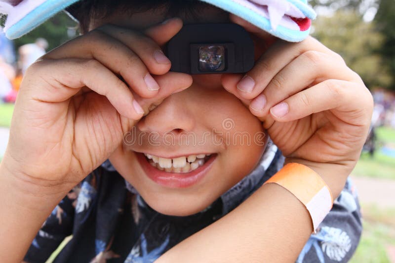 Boy Playing with Camera Eye Piece Stock Image - Image of camera ...
