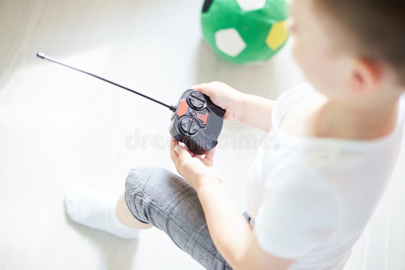 A Boy Playing with a Car Remote Stock Image - Image of interest ...