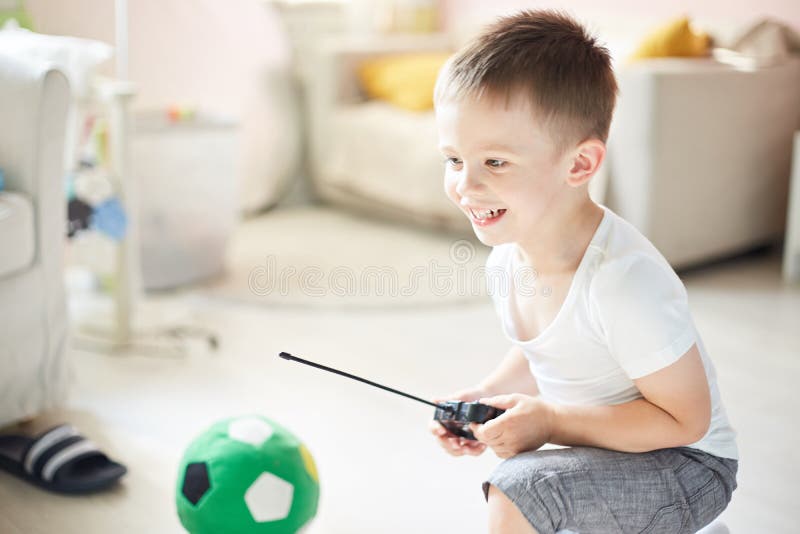 A Boy Playing with a Car Remote Stock Photo - Image of baby, model ...
