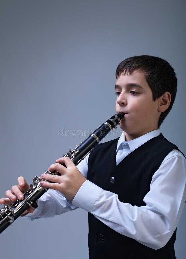 Boy Playing on the Clarinet Stock Image - Image of playing, handsome ...