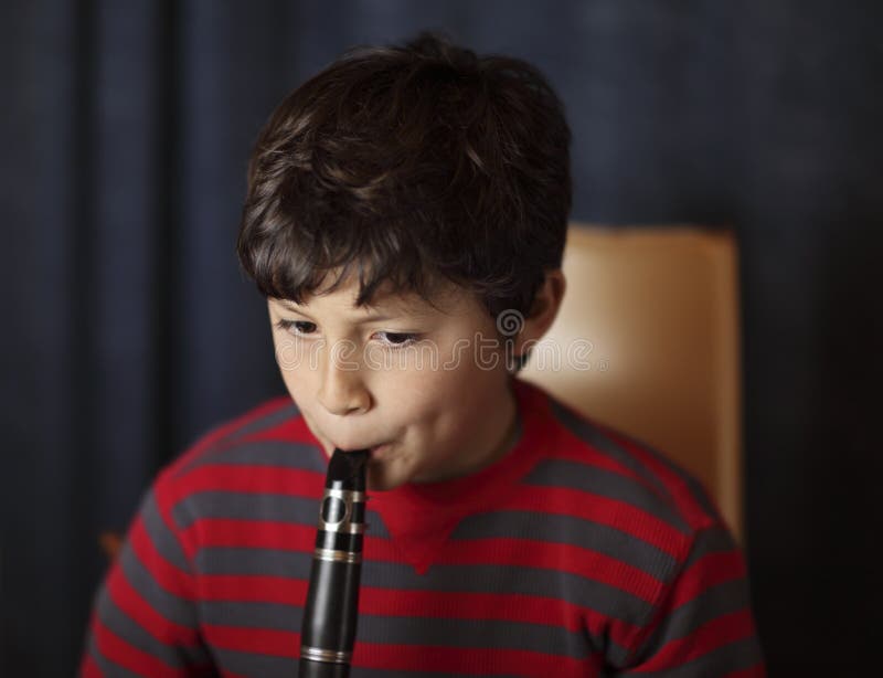 Boy playing clarinet stock image. Image of portrait, concentration ...