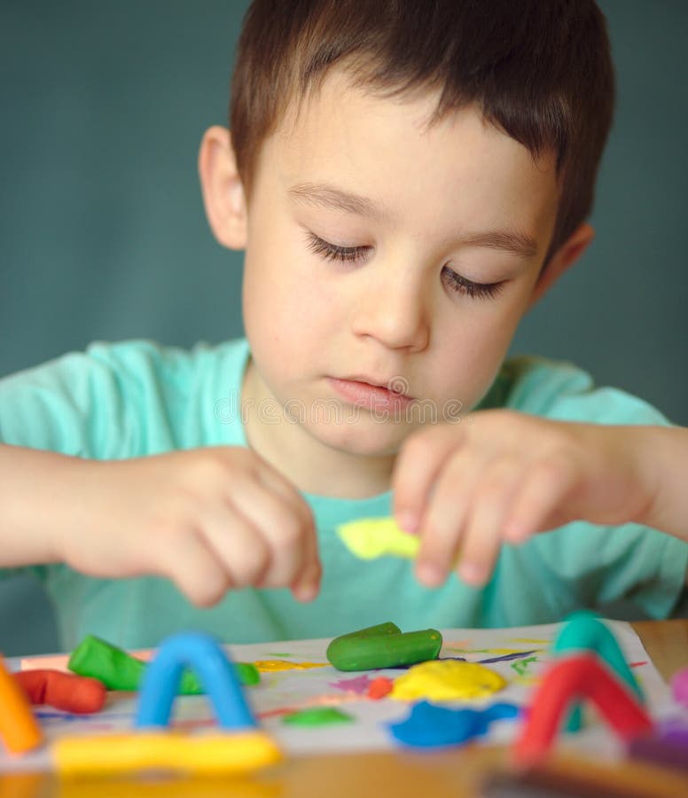Boy Playing with Color Play Dough Stock Image - Image of focused, cute ...