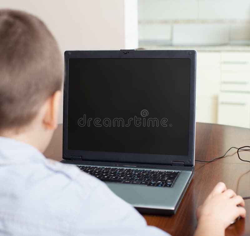 Boy playing a computer stock photo. Image of contemplation - 18717620