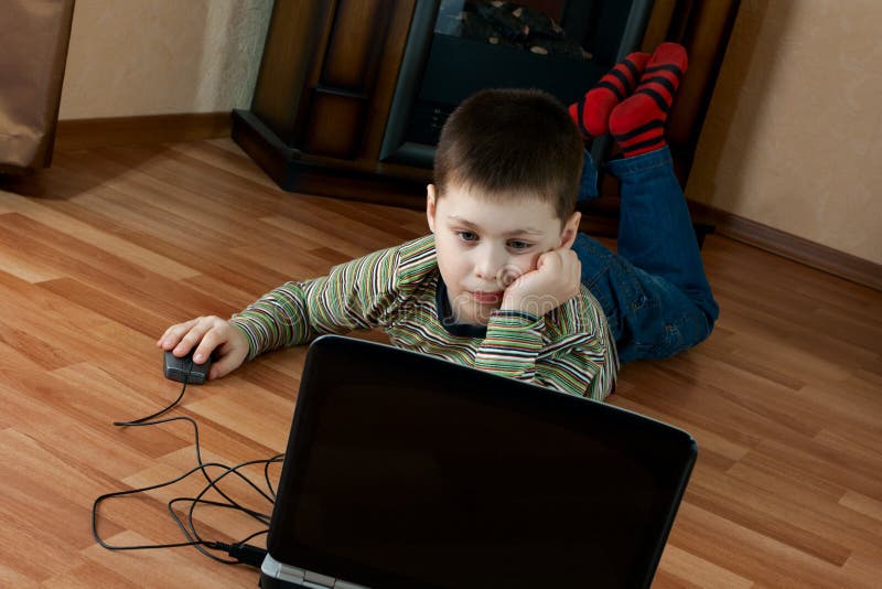 Boy playing computer game stock image. Image of education - 13647719