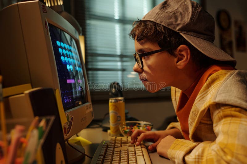 Boy Playing Computer Game with Intense Concentration Stock Photo ...