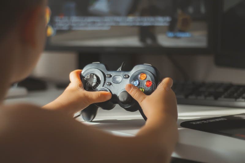 The Boy is Playing a Computer Game. Joystick in Hand Stock Photo ...