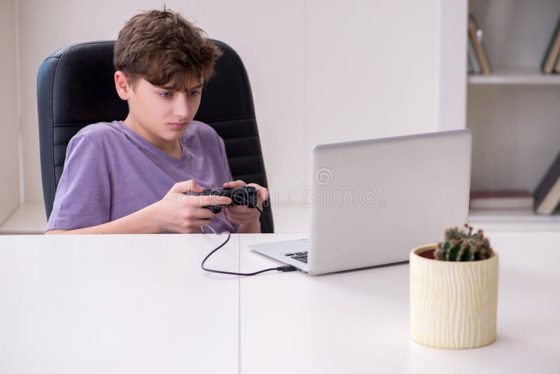 Schoolboy Playing Computer Games at Home Stock Photo - Image of ...