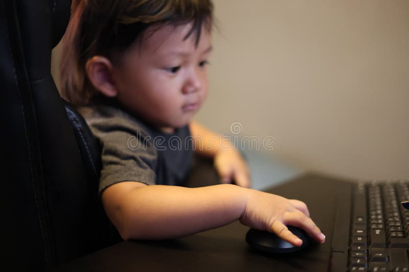Boy Playing on Computer at Home Stock Photo - Image of home ...