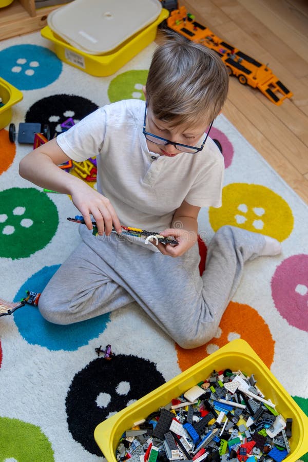 Boy Playing with Construction Bricks on Floor. Stock Image - Image of ...