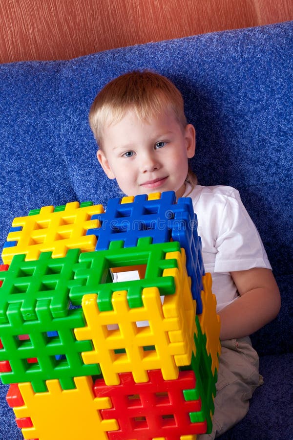 Boy playing with cubes stock image. Image of create, green - 28696135