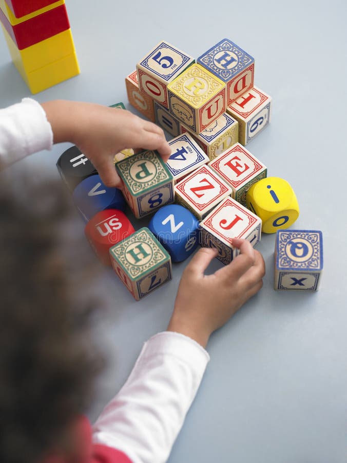 Boy Playing with Cubes stock image. Image of alphabet - 29656499