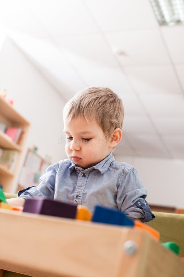 Boy playing with cubes stock photo. Image of cube, brick - 94769930