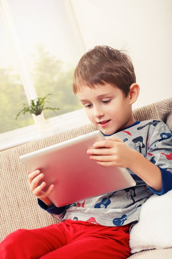 Boy Playing with Digital Tablet Stock Photo - Image of indoors, modern ...