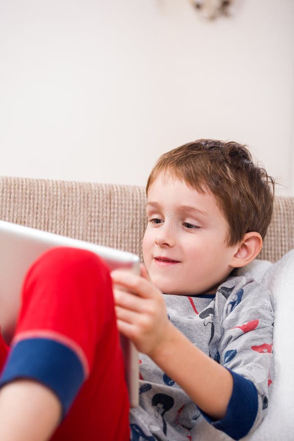 Boy Playing with Digital Tablet Stock Image - Image of looking, little ...