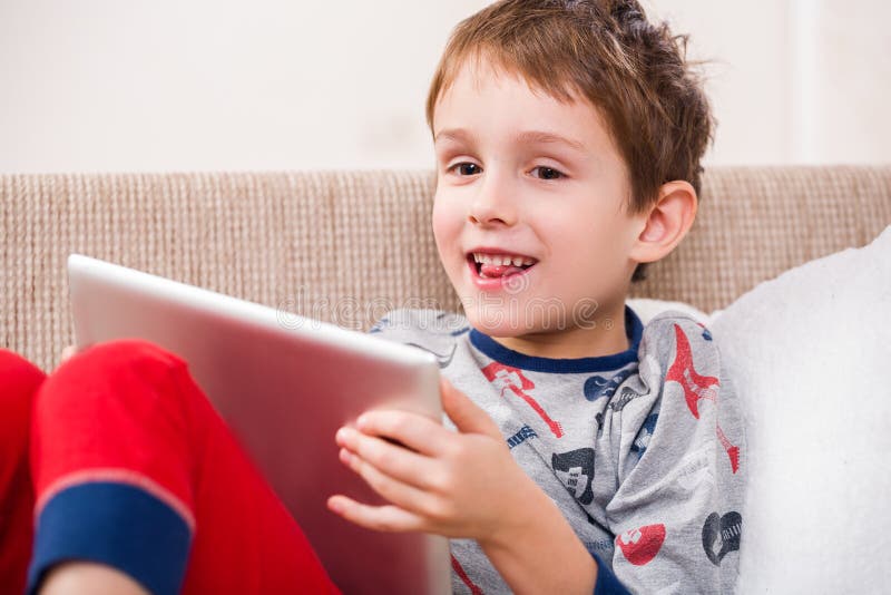 Boy Playing with Digital Tablet Stock Photo - Image of cute, horizontal ...