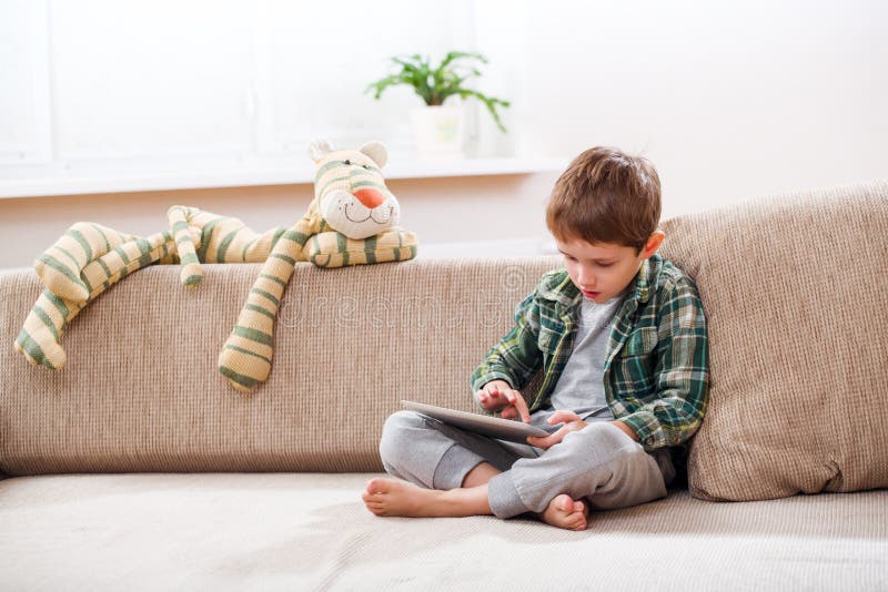 Boy Playing with Digital Tablet Stock Image - Image of digital, male ...