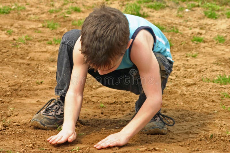 Boy Playing in the Dirt stock photo. Image of male, children - 2248450